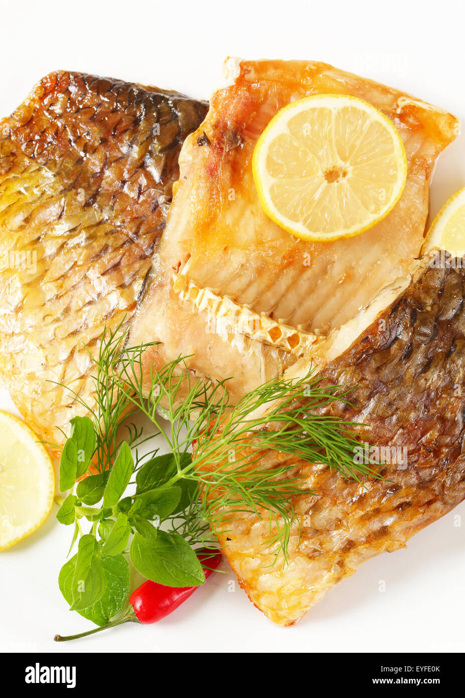 Oven baked carp fillets with crispy skin Stock Photo - Alamy