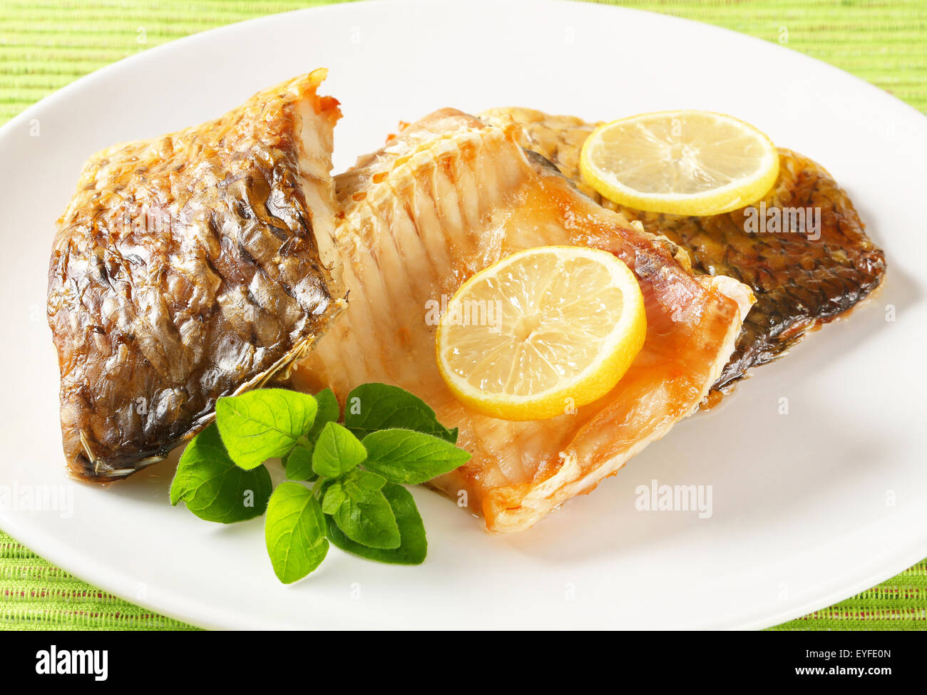Oven baked carp fillets with crispy skin Stock Photo - Alamy