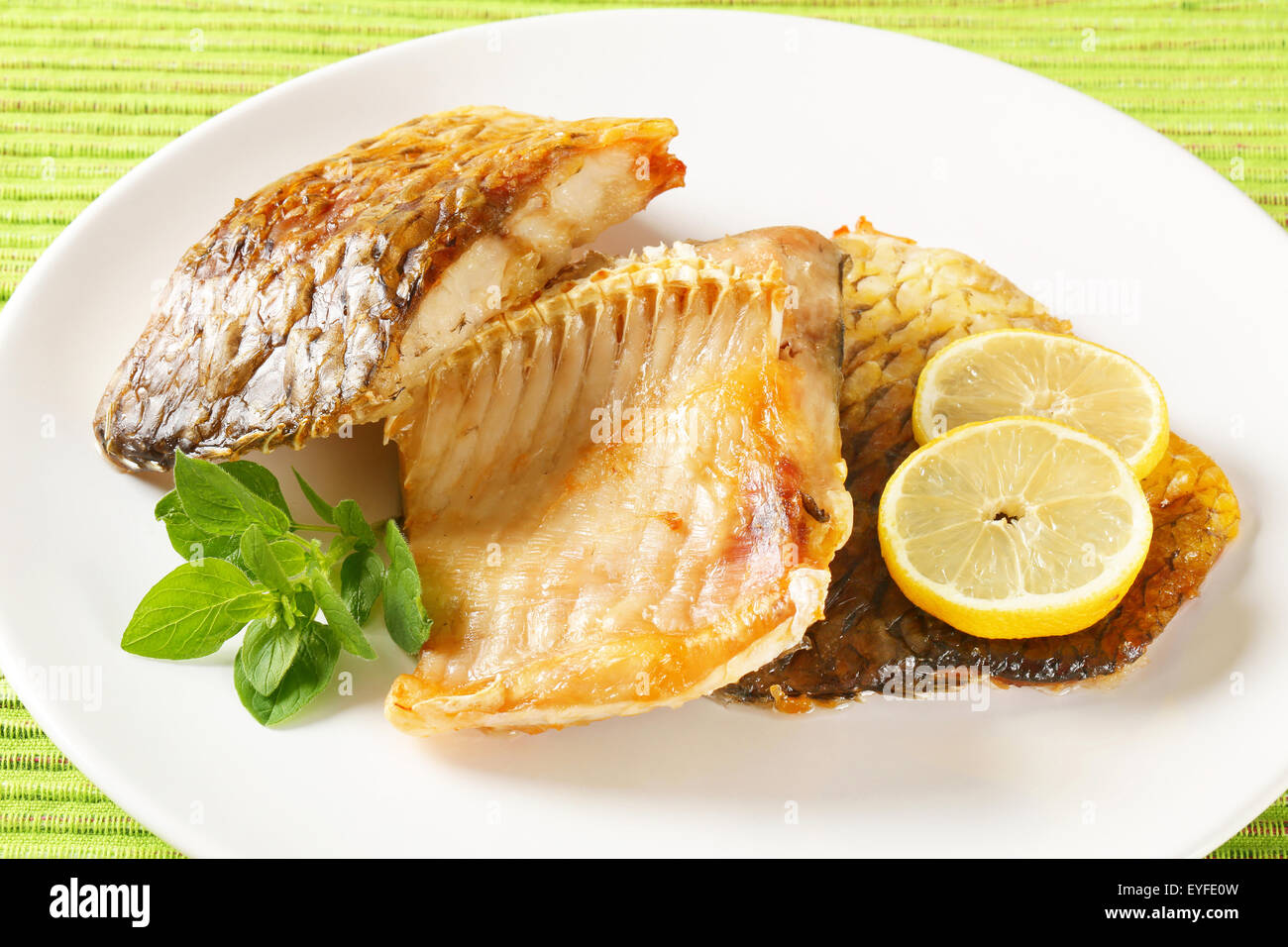 Oven baked carp fillets with crispy skin Stock Photo - Alamy
