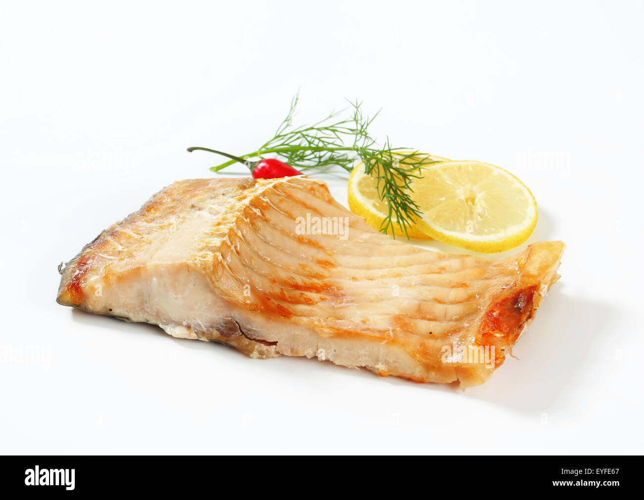 Oven-baked carp fillet - studio shot Stock Photo - Alamy