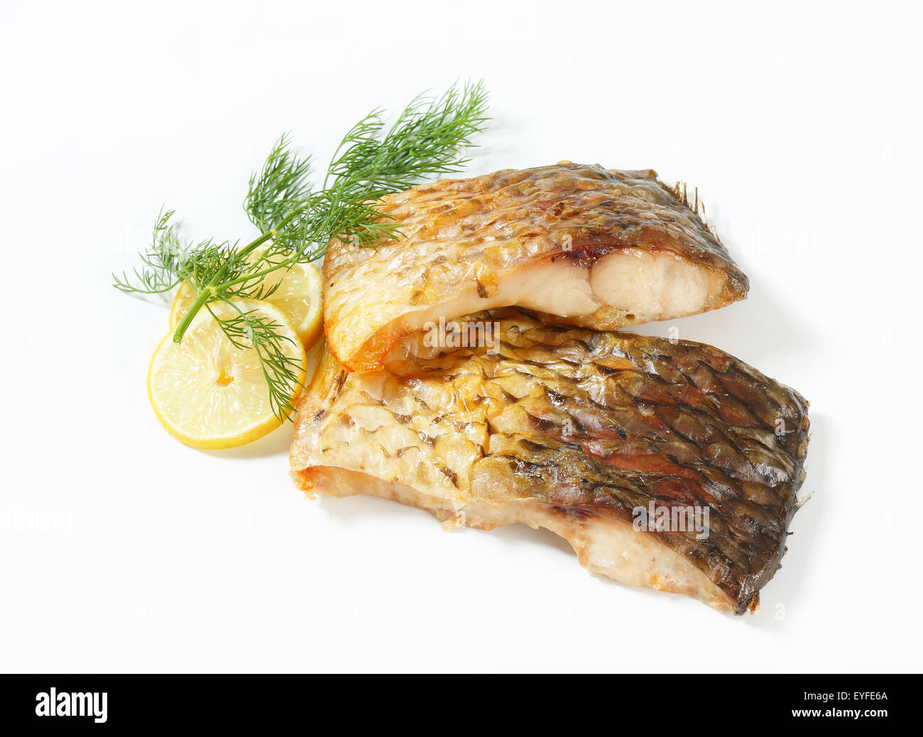 Oven-baked carp fillet - studio shot Stock Photo - Alamy