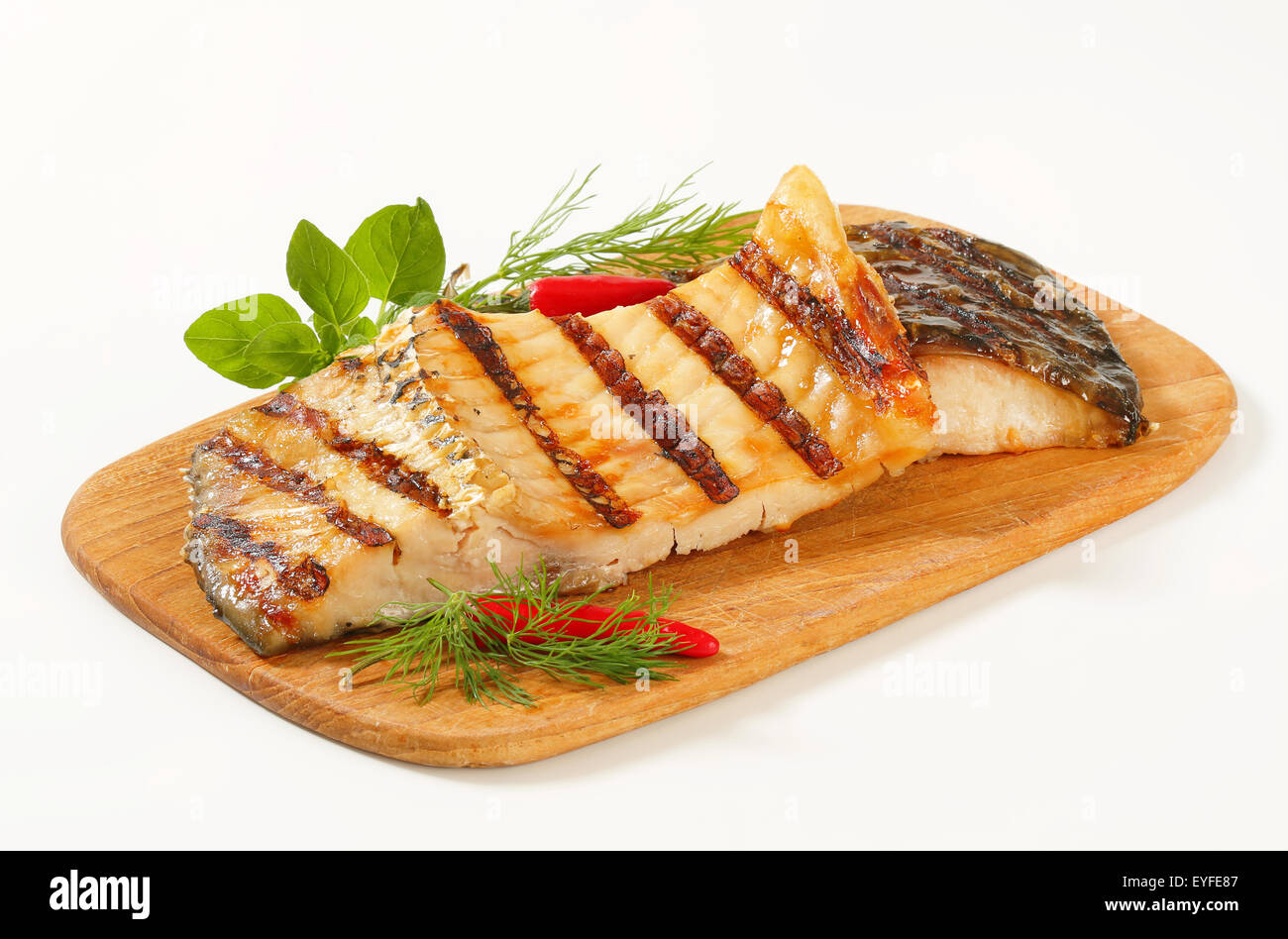 Grilled carp fillets on cutting board Stock Photo - Alamy