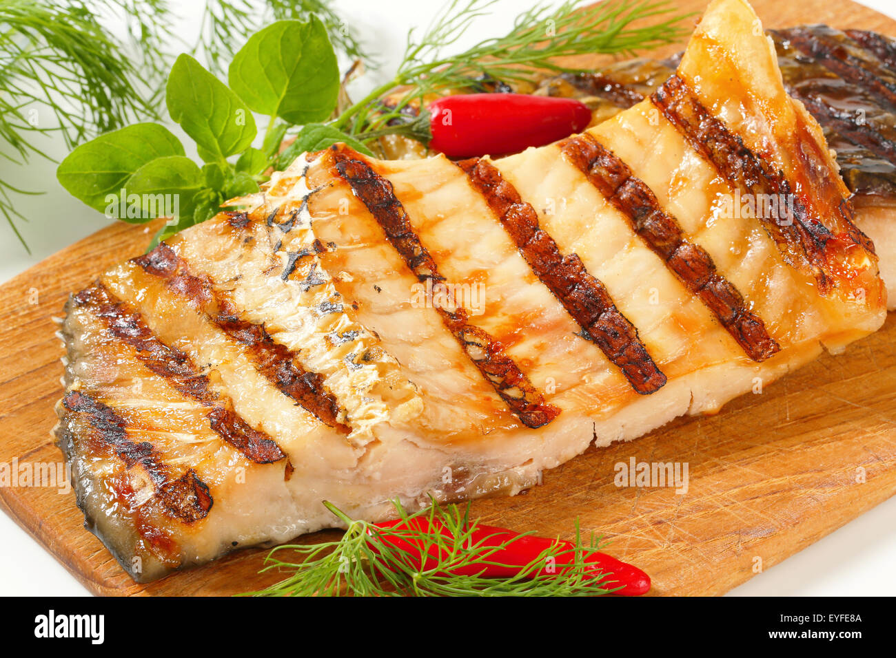 Grilled carp fillets on cutting board Stock Photo - Alamy