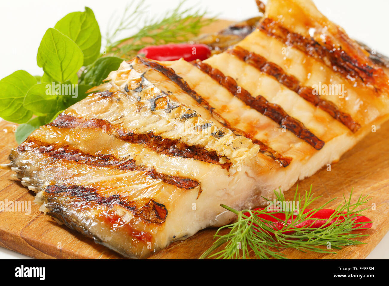 Grilled carp fillets on cutting board Stock Photo - Alamy