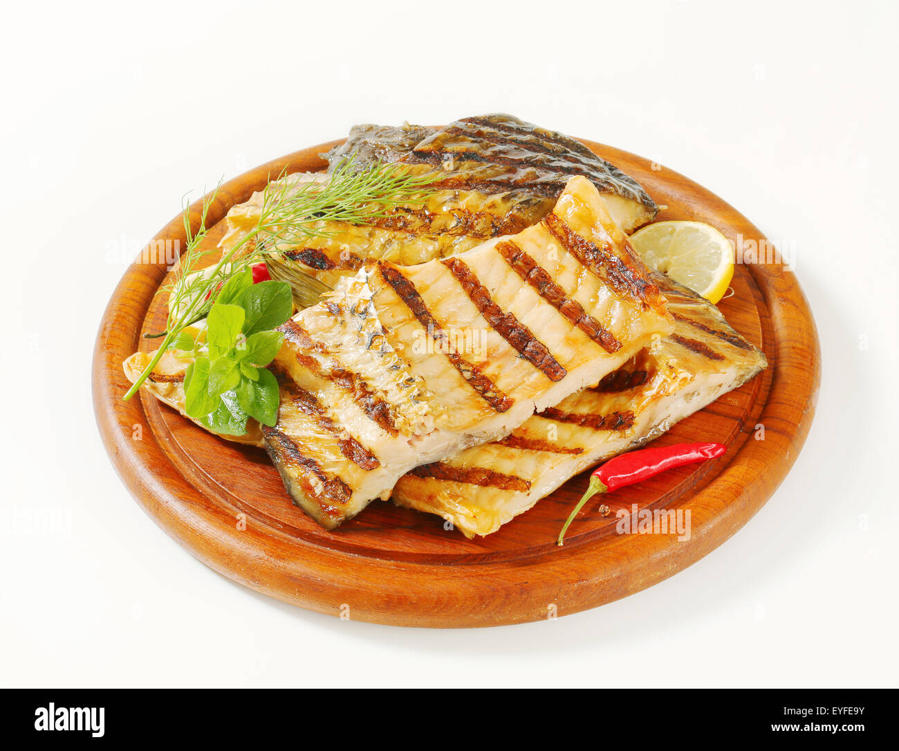 Grilled carp fillets on cutting board Stock Photo - Alamy