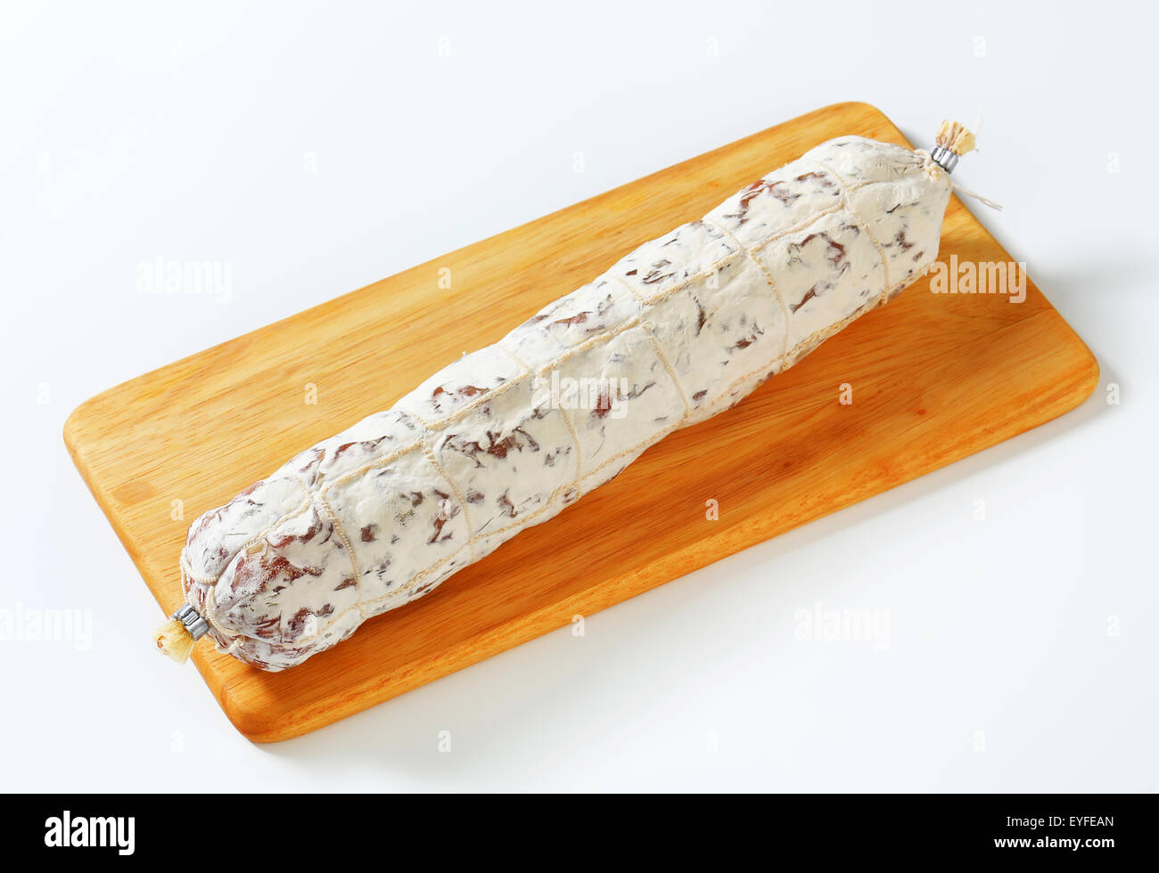 French Saucisson Sec on cutting board Stock Photo - Alamy