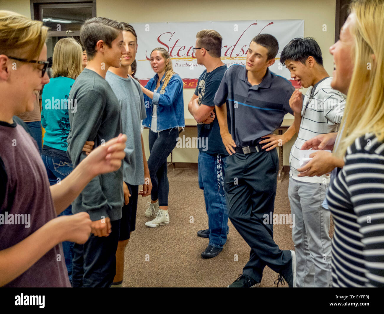 Multiracial teenagers socialize at a confirmation preparation class at ...