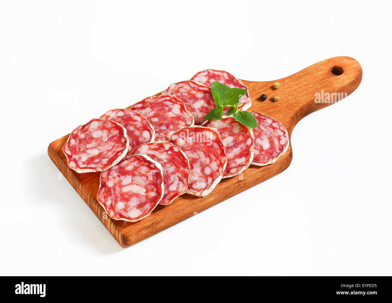 Sliced French Saucisson Sec on cutting board Stock Photo - Alamy