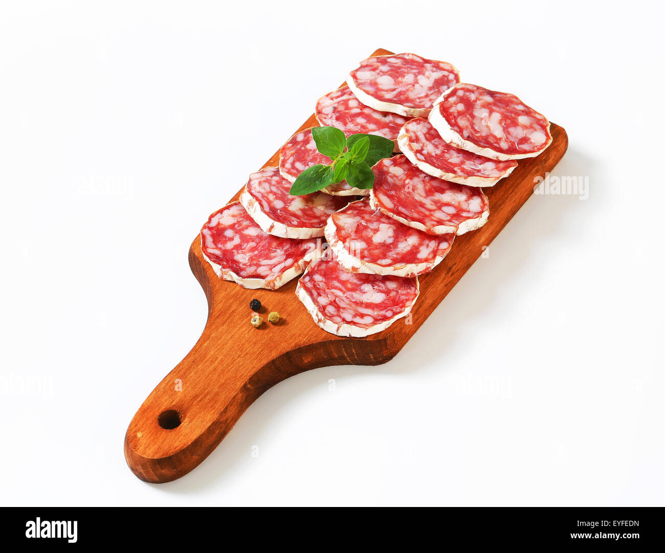 Sliced French Saucisson Sec on cutting board Stock Photo - Alamy