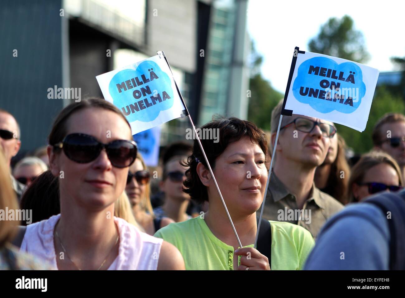 Helsinki. 28th July, 2015. Demonstrators hold a banner carrying the ...