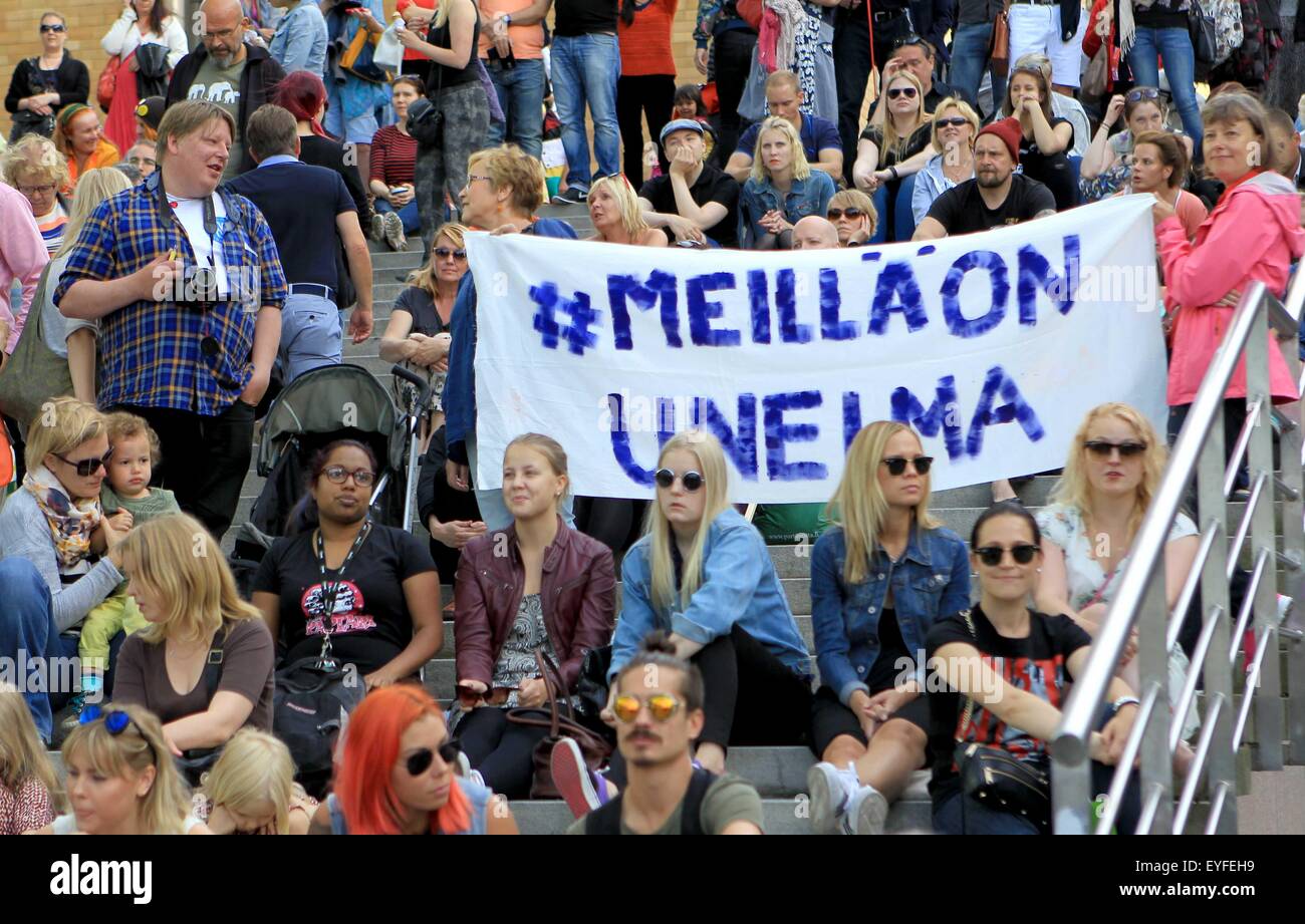 Helsinki. 28th July, 2015. Demonstrators hold a banner carrying the ...
