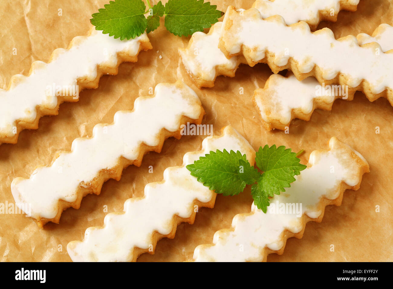 Vanilla cookies with white icing Stock Photo - Alamy