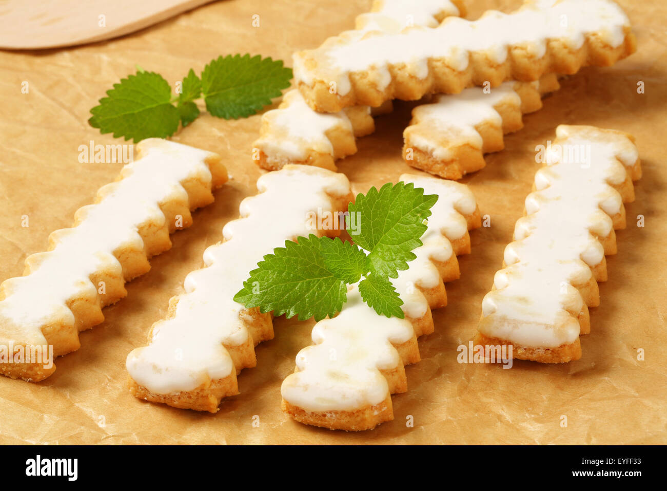 Vanilla cookies with white icing Stock Photo - Alamy