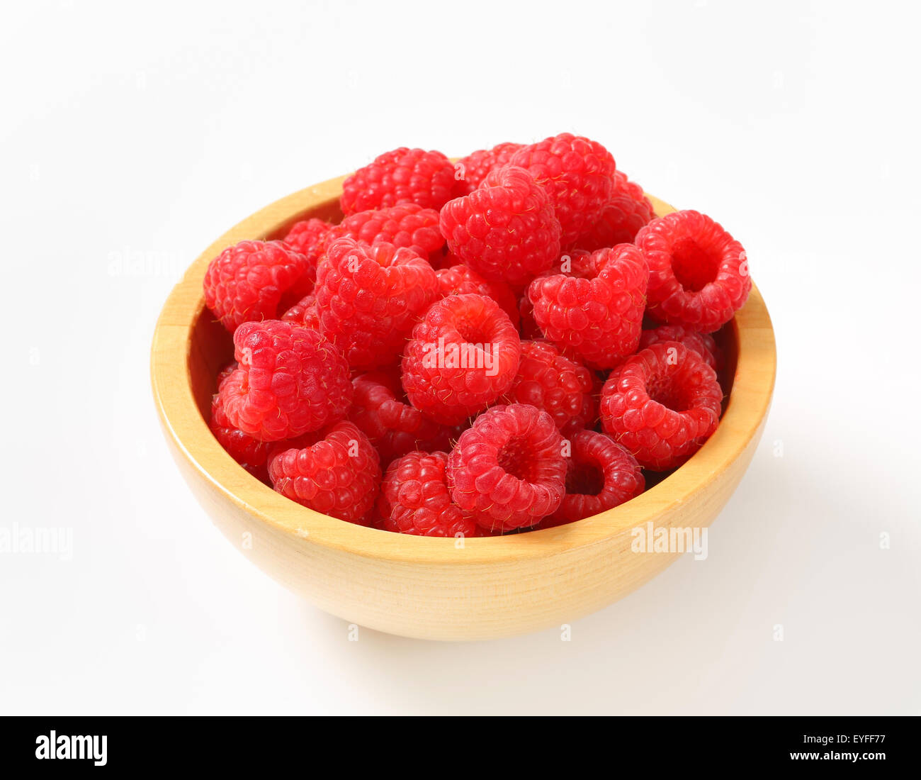 Fresh raspberries in a wooden bowl Stock Photo - Alamy
