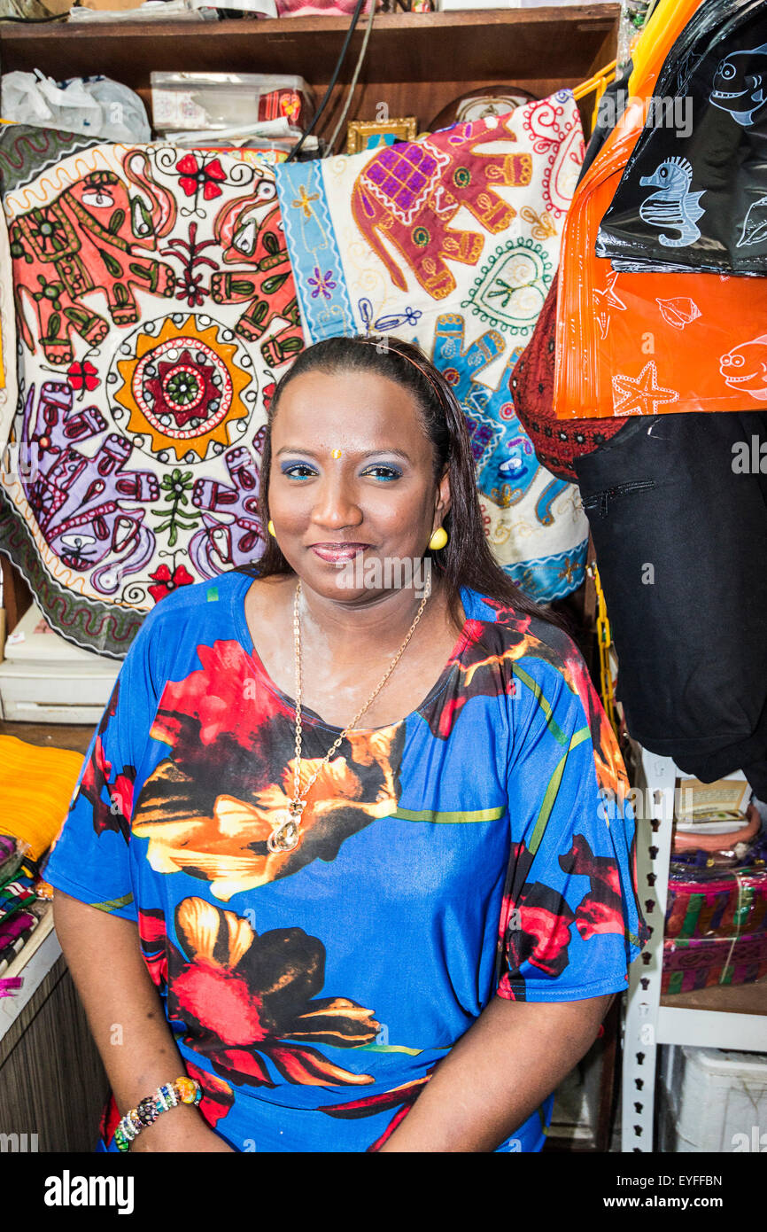 Local shopkeeper woman in a scarf shop in Singapore's Little India ...
