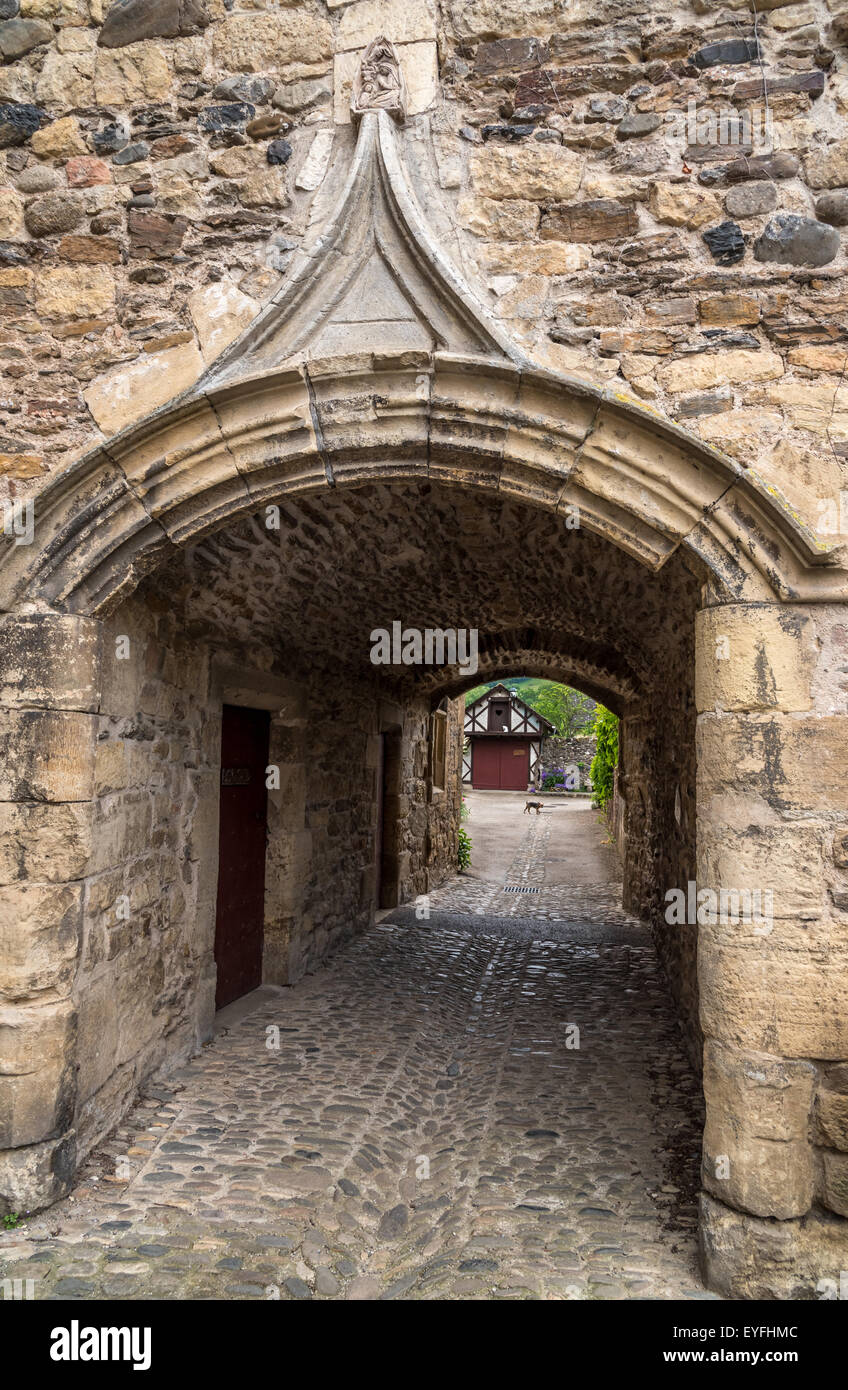 Archway in old building in the small medieval town of St-Eulalie-d'Olt ...