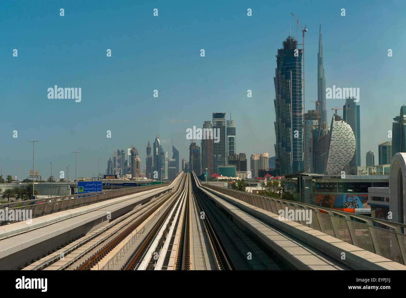 Looking along train track to the Burj Khalifa and other buildings ...
