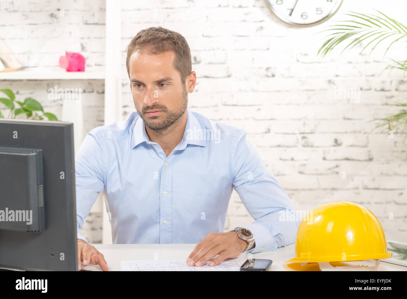 young engineer working on his computer in his office Stock Photo - Alamy
