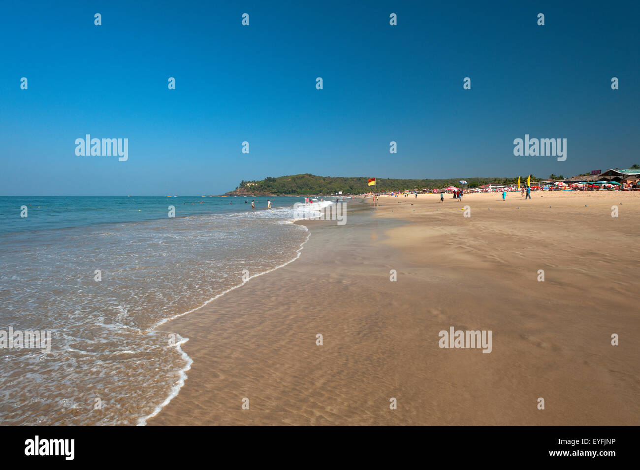 Beach with blue sky; Baga, Goa, India Stock Photo - Alamy