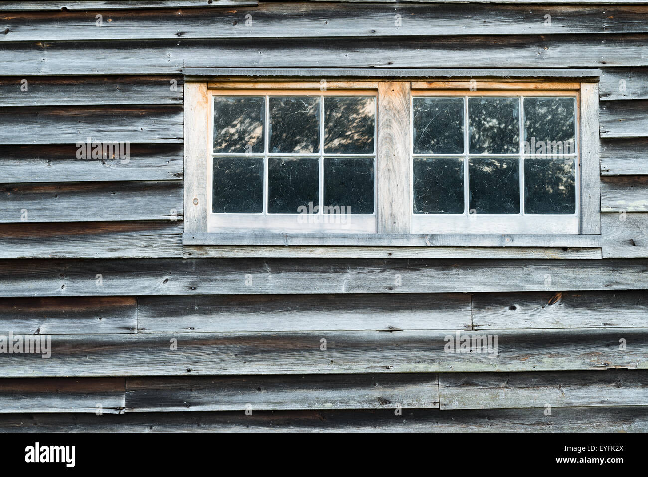 Weathered Barn Wall with Overlapped Gray and Brown Wood Siding with Two ...
