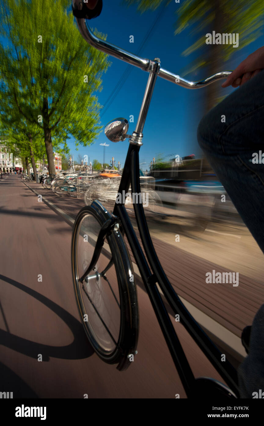 Cycling down cycle path; Amsterdam, Holland Stock Photo - Alamy