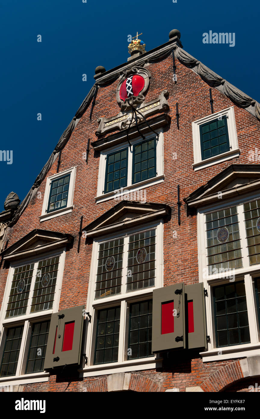 Traditional Dutch building with coat of arms of Amsterdam at top, three ...