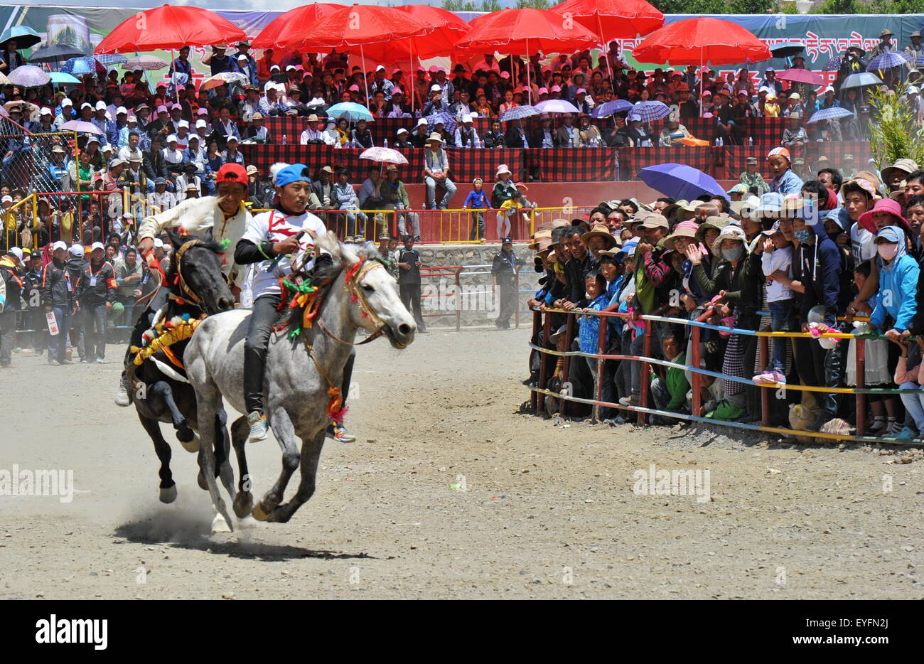 Jiangzi, China's Tibet Autonomous Region. 28th July, 2015. People race ...