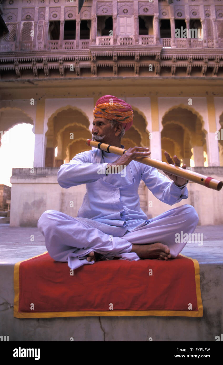Man playing traditional wooden flute, Mehrangarh Fort; Jodhpur ...