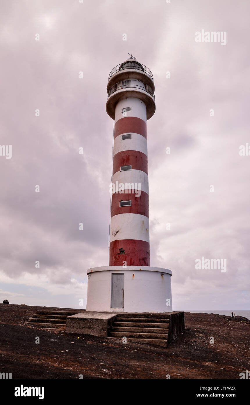High Lighthouse near the Coast Stock Photo - Alamy
