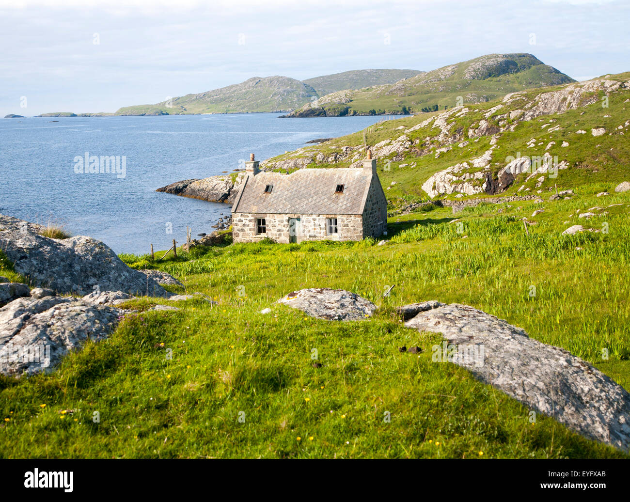 Deserted derelict croft cottage in coastal location on Vatersay Island ...