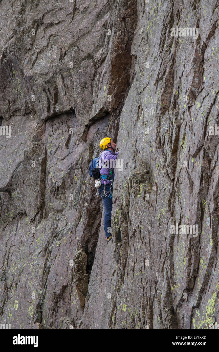 Rock climbers on Great Gable, in the Lake District UK climbing on the ...