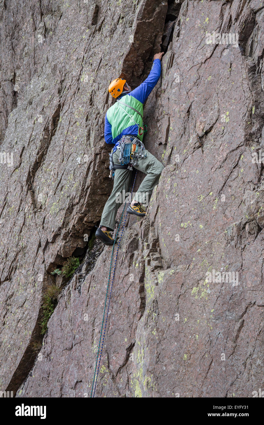 Rock climbers on Great Gable, in the Lake District UK climbing on the ...