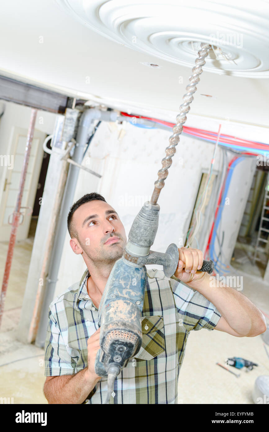 Drilling into the ceiling Stock Photo - Alamy