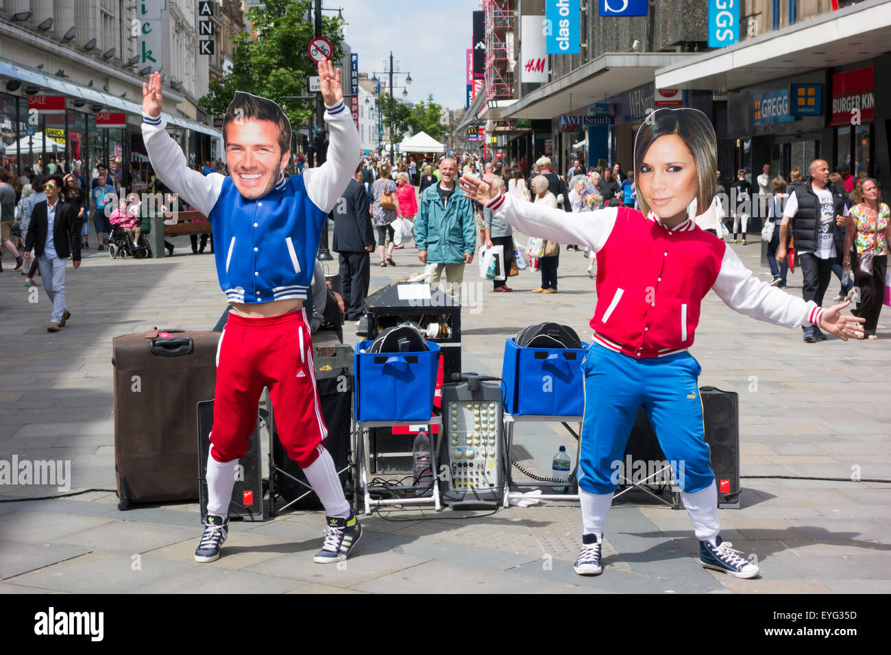 Buskers wearing masks of famous people/celebrites performing on ...