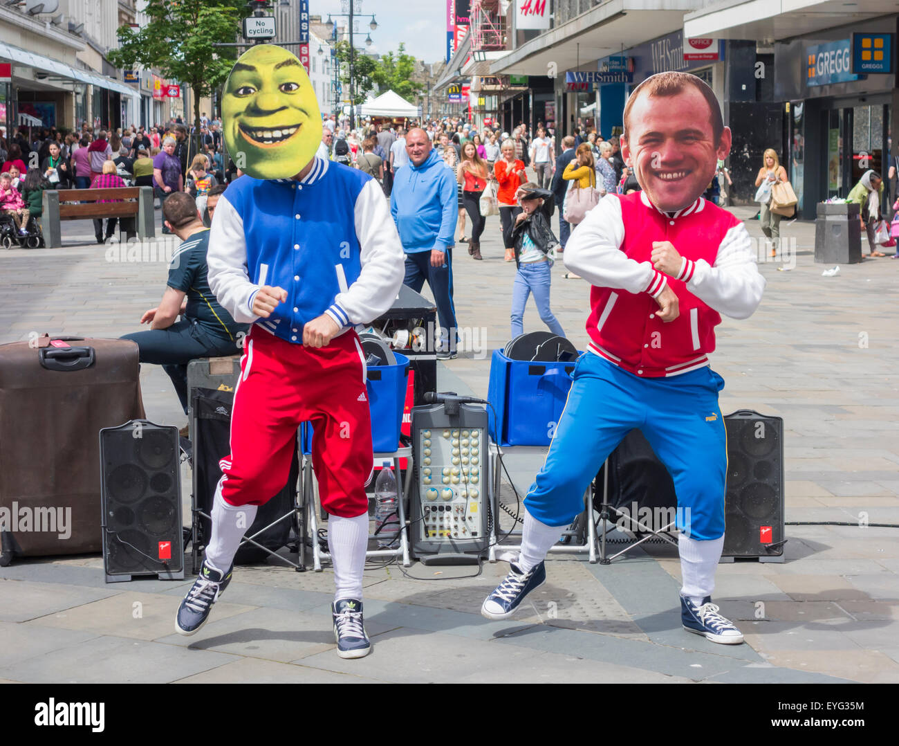 Buskers wearing masks of famous people/celebrites performing on ...
