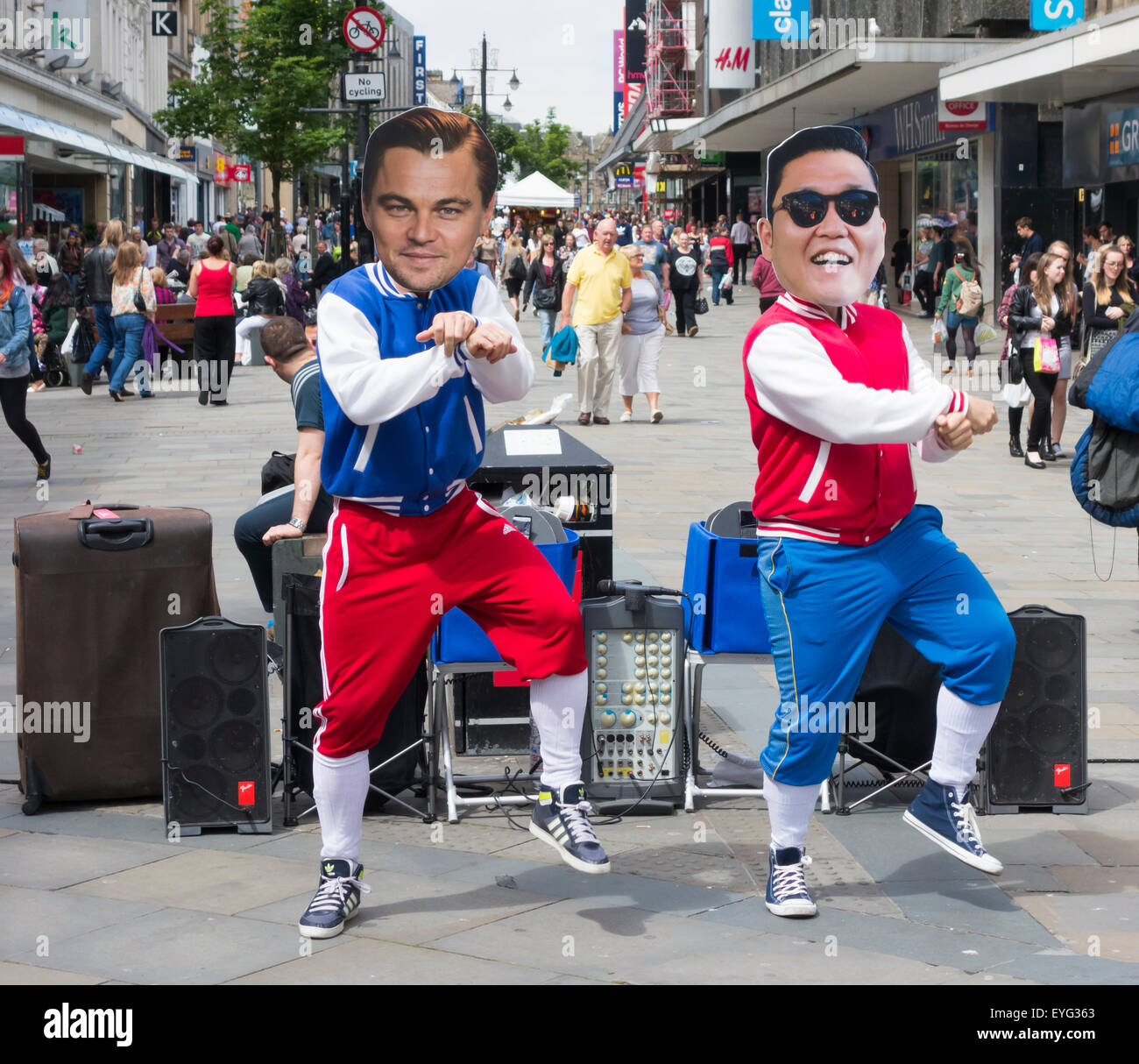 Buskers wearing masks of famous people/celebrites performing on ...