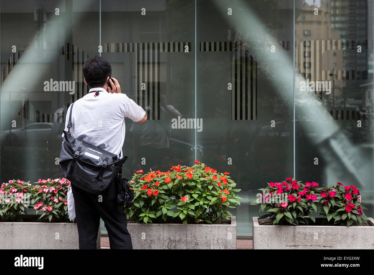 A pedestrian stands in front of the LOTTE Japan headquarters in ...
