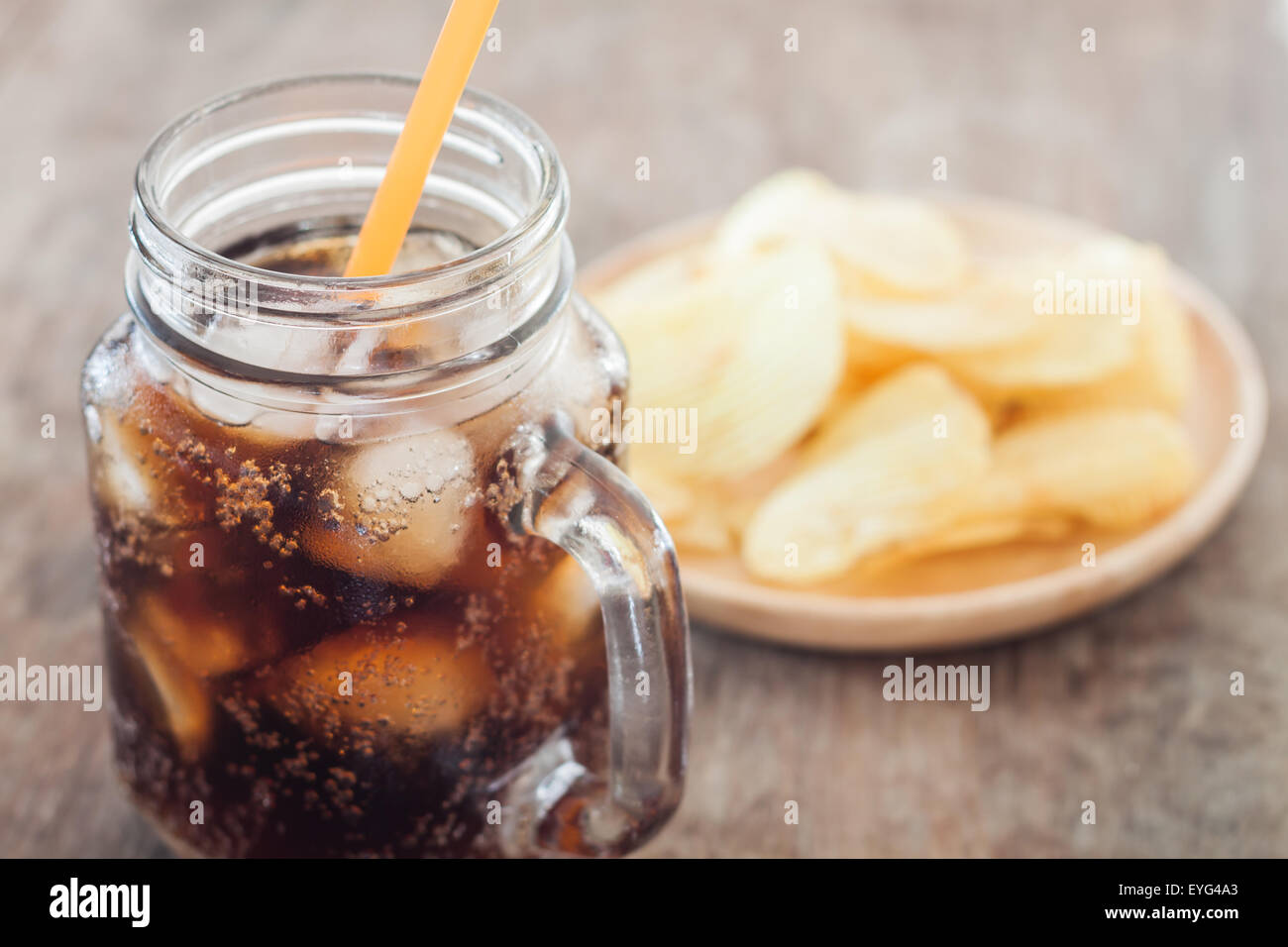 Iced cola with potato chips, stock photo Stock Photo - Alamy