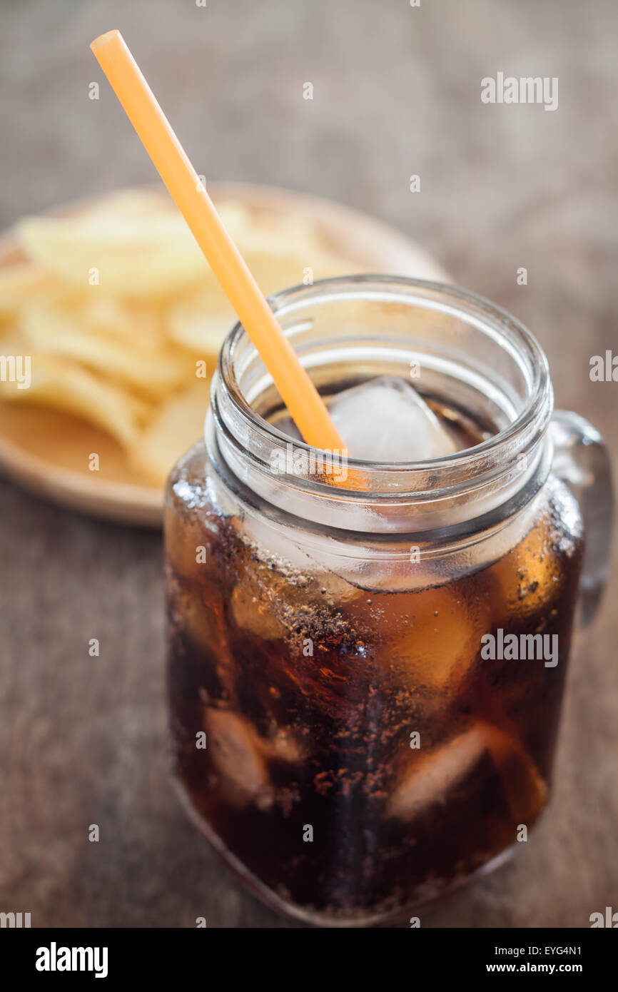 Iced cola with potato chips, stock photo Stock Photo - Alamy
