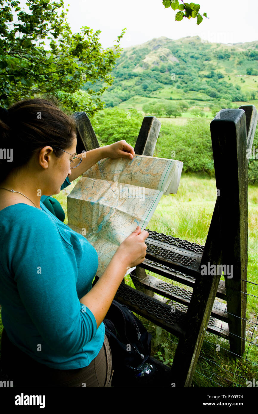 Female walker checking map hi-res stock photography and images - Alamy