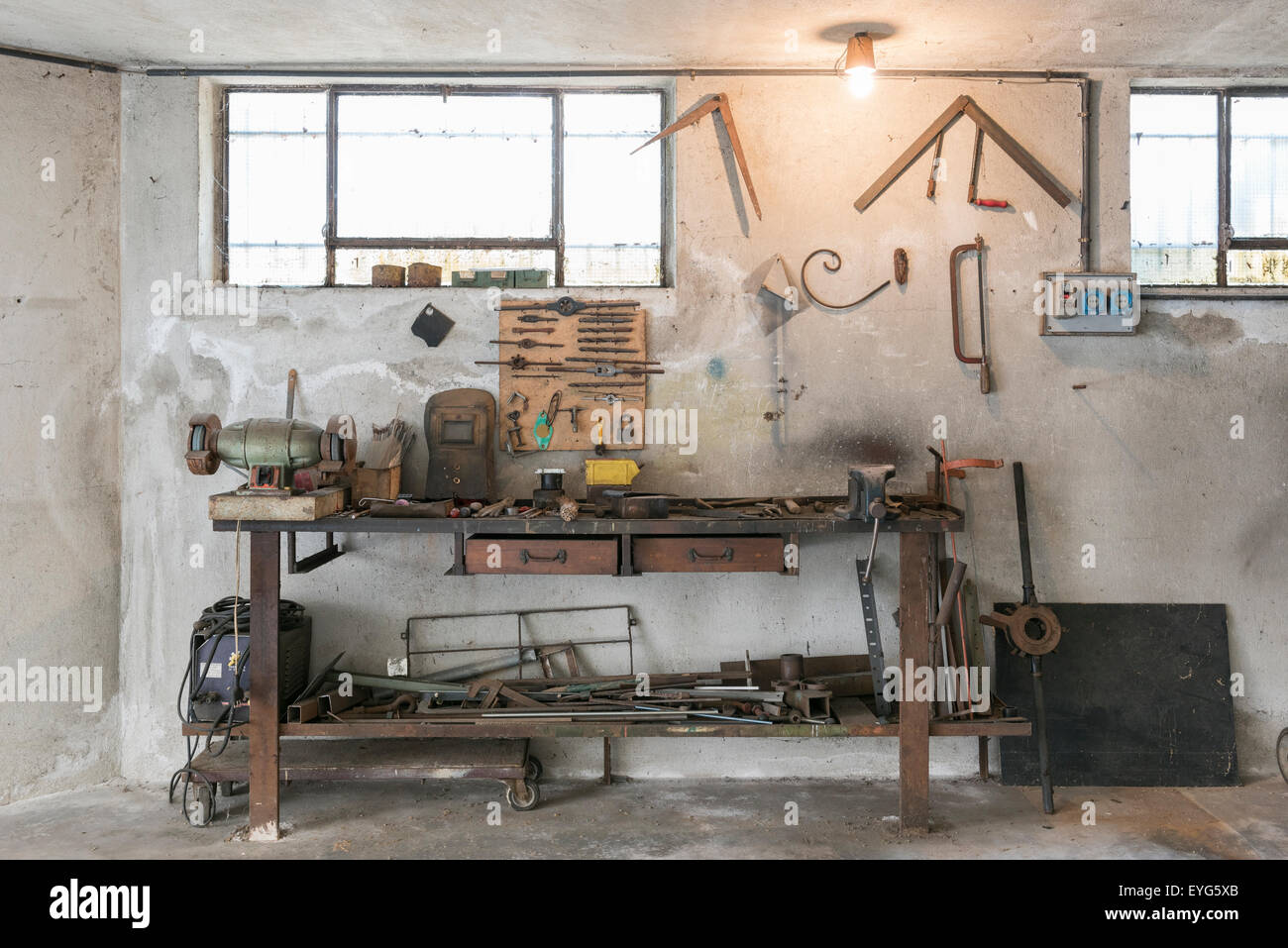 old workbench with old work tools in home garage Stock Photo - Alamy