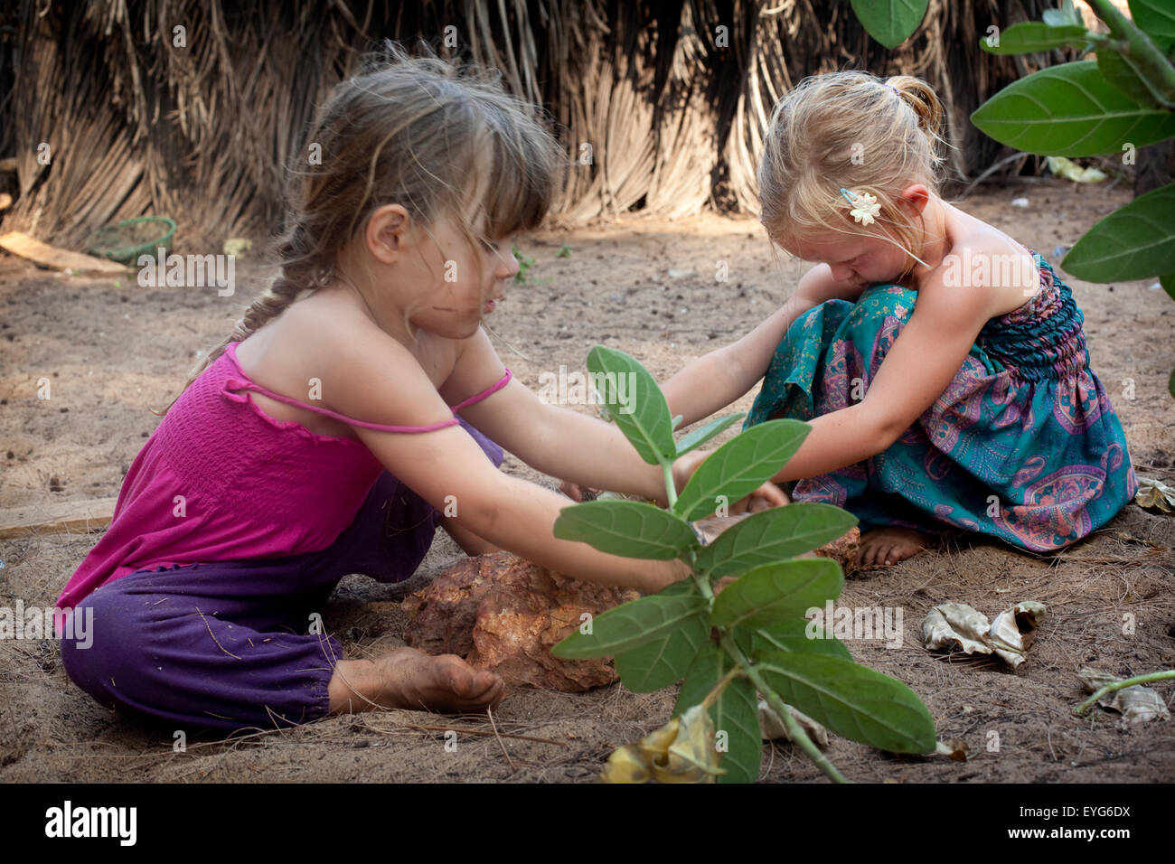 Kiki Lett and Isla Reynolds play together, on Turtle Beach, Goa, India ...