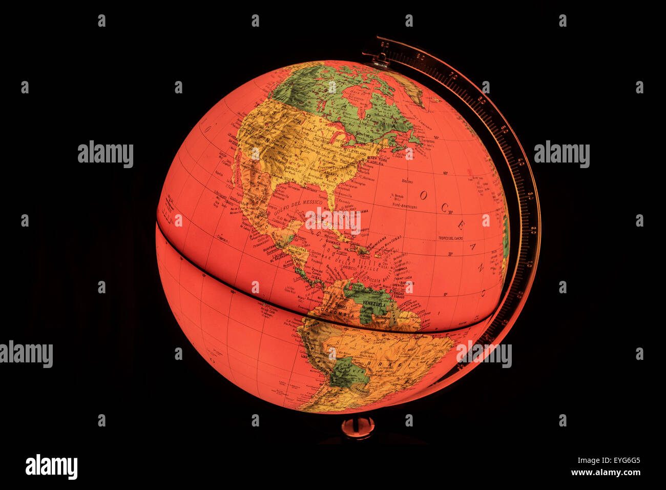 red light world globe illuminated from within with closeup on North and ...