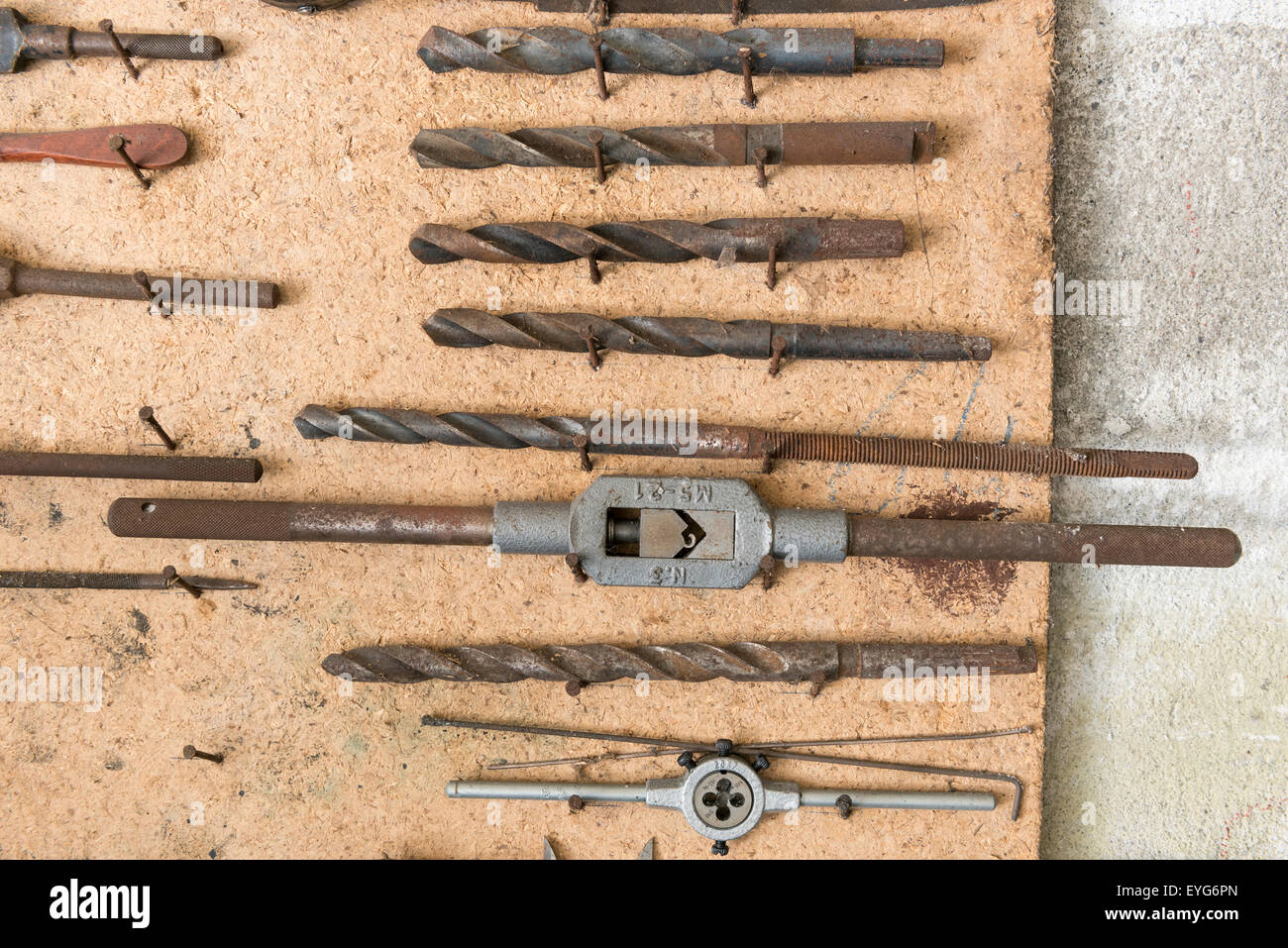 old work tools hanging in wall garage Stock Photo - Alamy