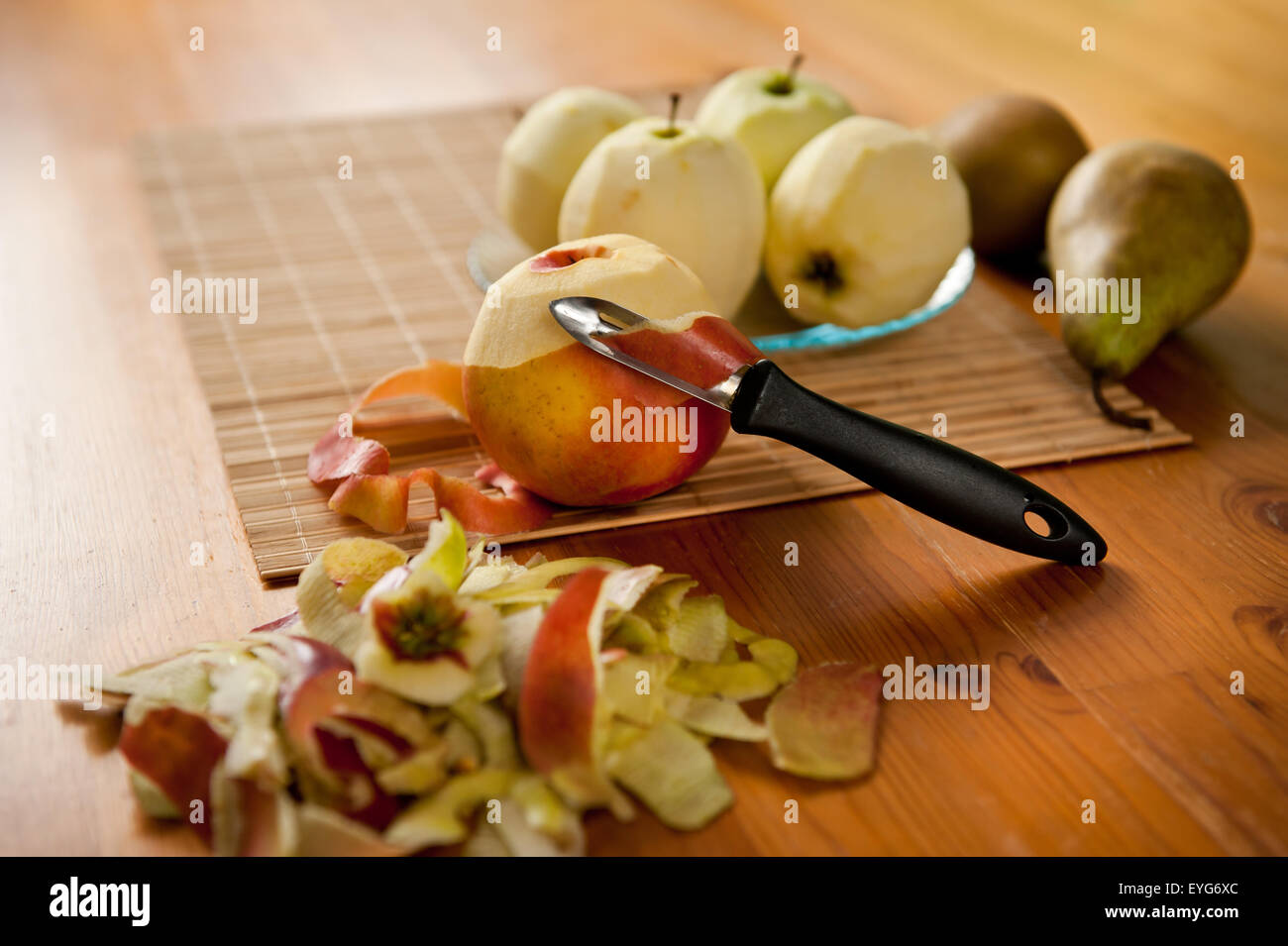 Apples peeling fruits lying on bamboo mat Stock Photo - Alamy