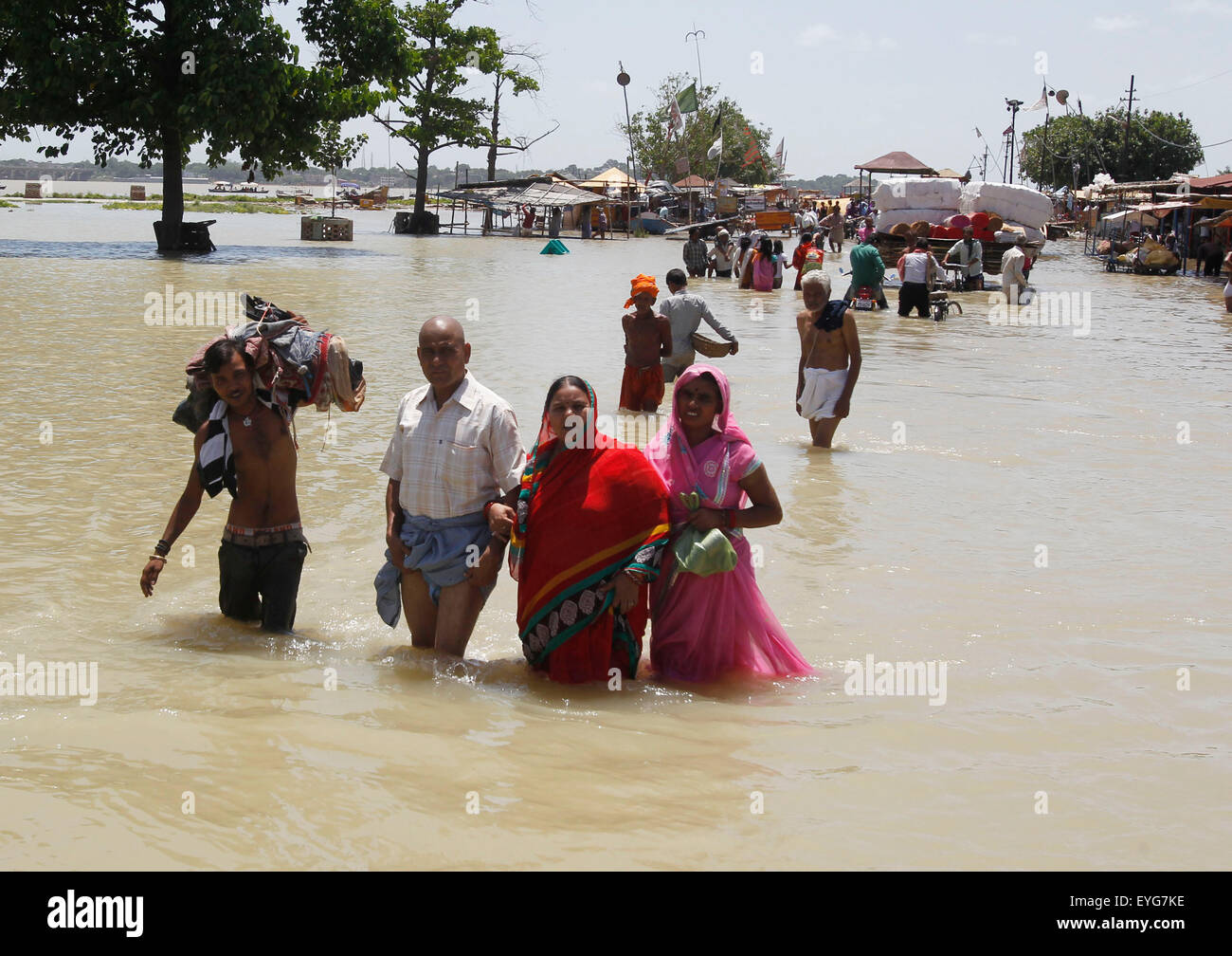 Allahabad, India. 29th July, 2015. Hindu devotees walk from flooded ...