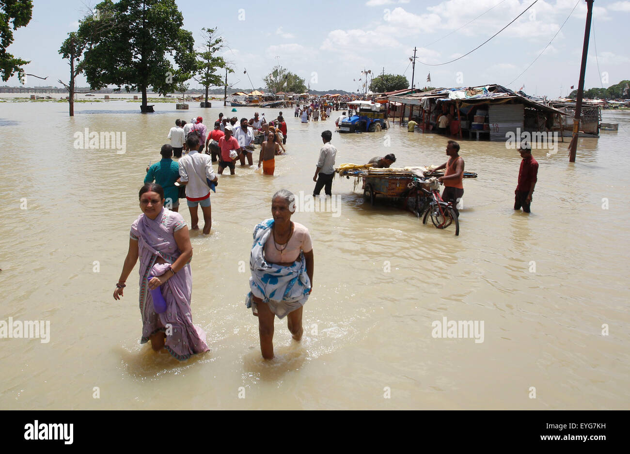Allahabad, India. 29th July, 2015. Hindu devotees walk from flooded ...