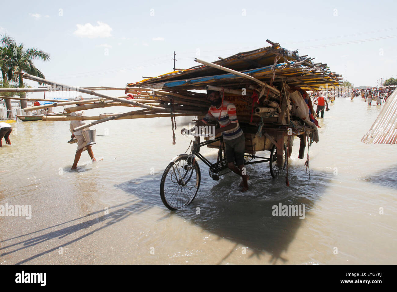 Allahabad, India. 29th July, 2015. People uses a trolley to transport ...