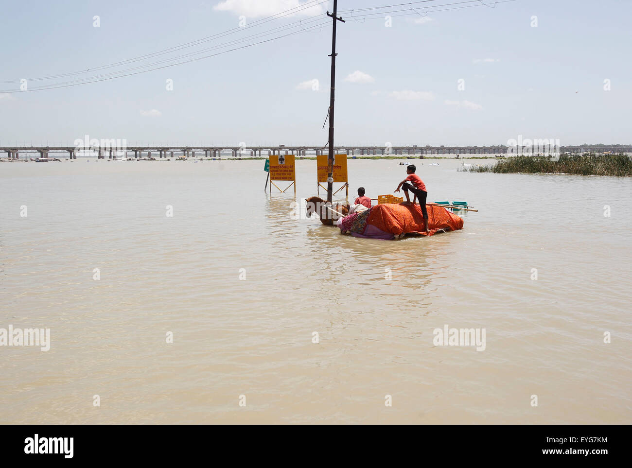 Allahabad, India. 29th July, 2015. People uses a trolley to transport ...