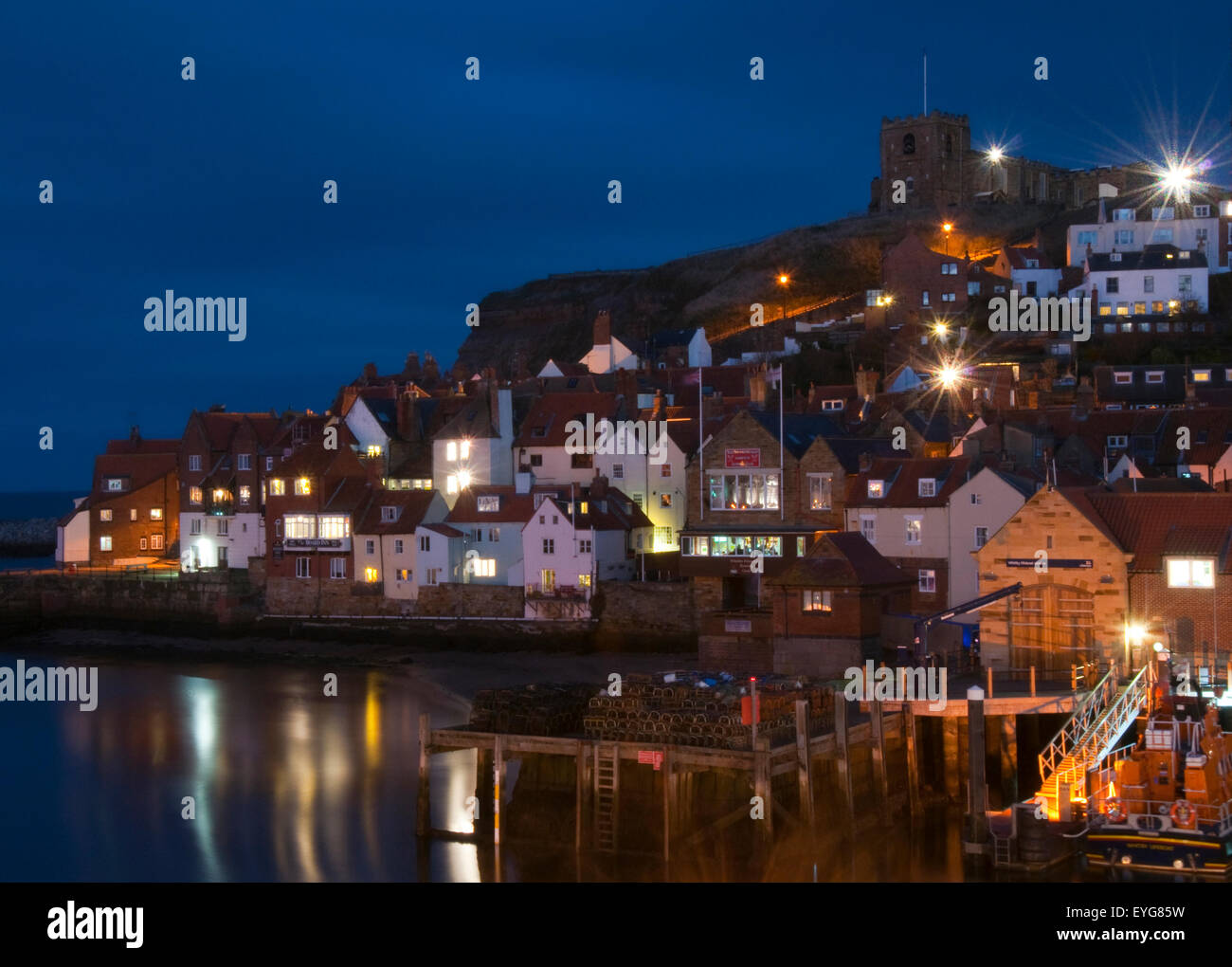 Night time blue hour in the harbour at Whitby, North Yorkshire England ...